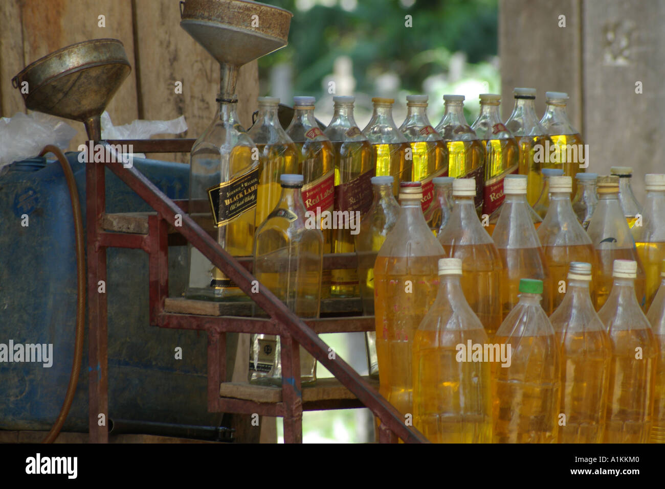 Fuel in Coke bottles at a Cambodian petrol station, Siem Reap, Cambodia ...