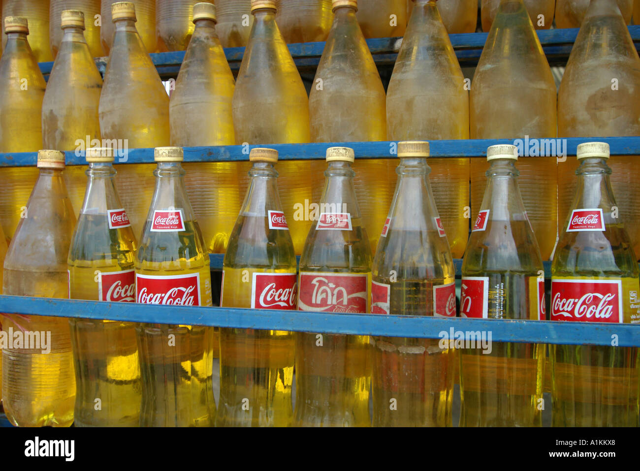 Fuel in Coke bottles at a Cambodian petrol station, Siem Reap, Cambodia ...