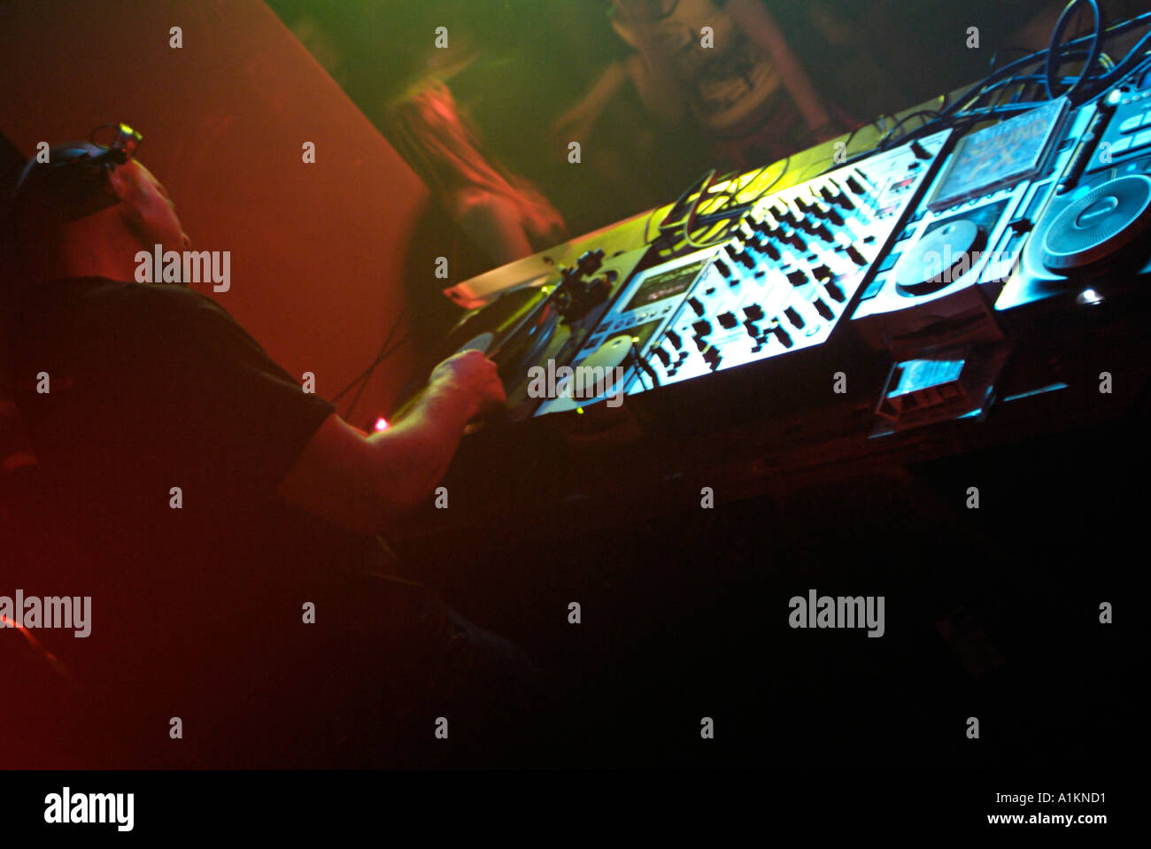 Club DJ Using a Turntable on the Decks of a Nightclub Stock Photo - Alamy