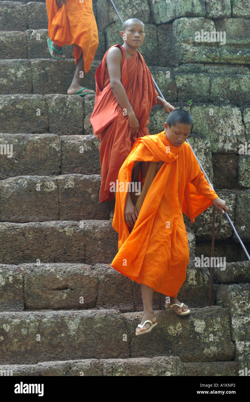 Buddhist Monks descending steps at Angkor Wat Temple, Siem Reap ...