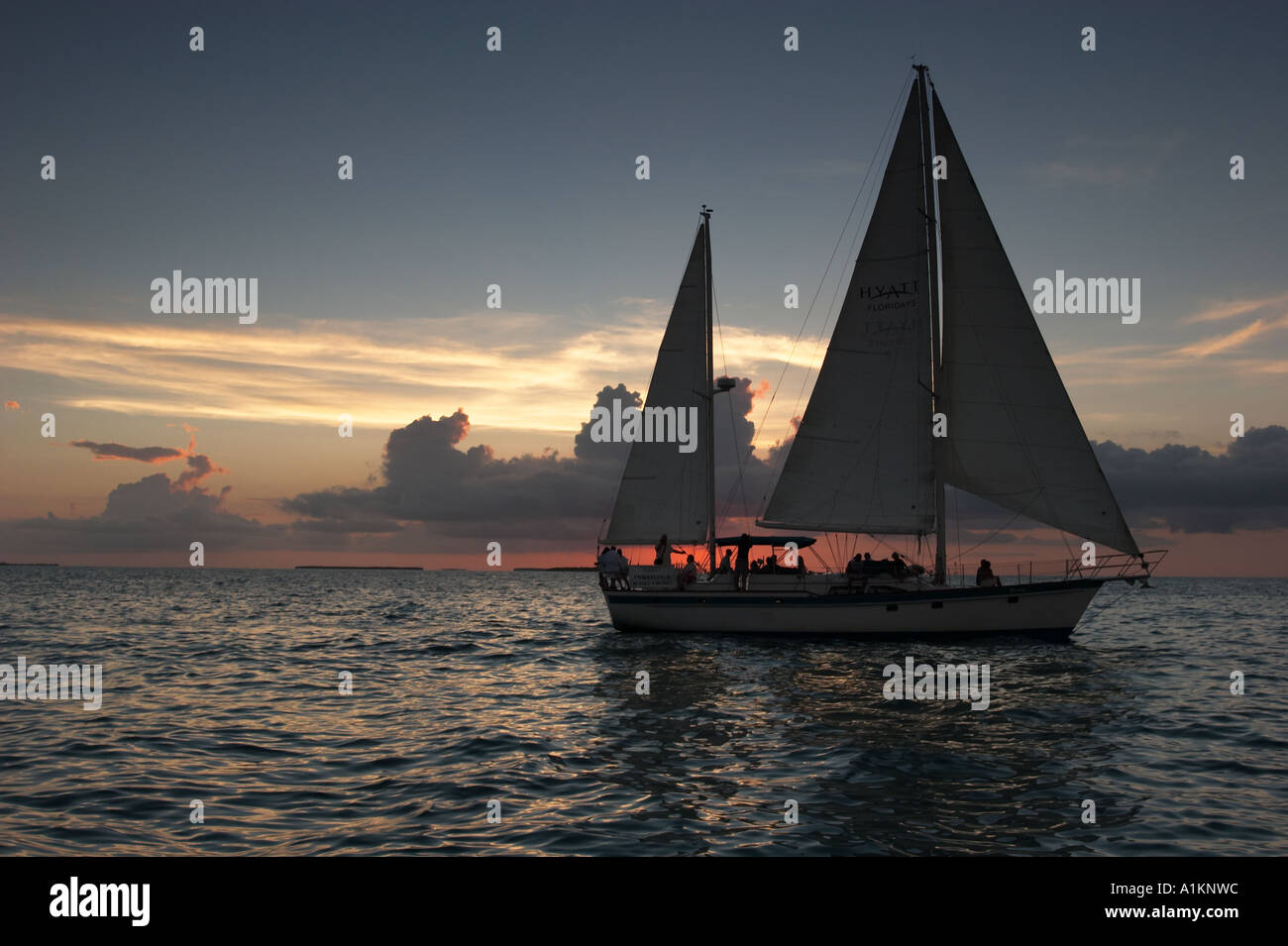A dramatic sunset with sailboat over the ocean off Florida's Key West ...