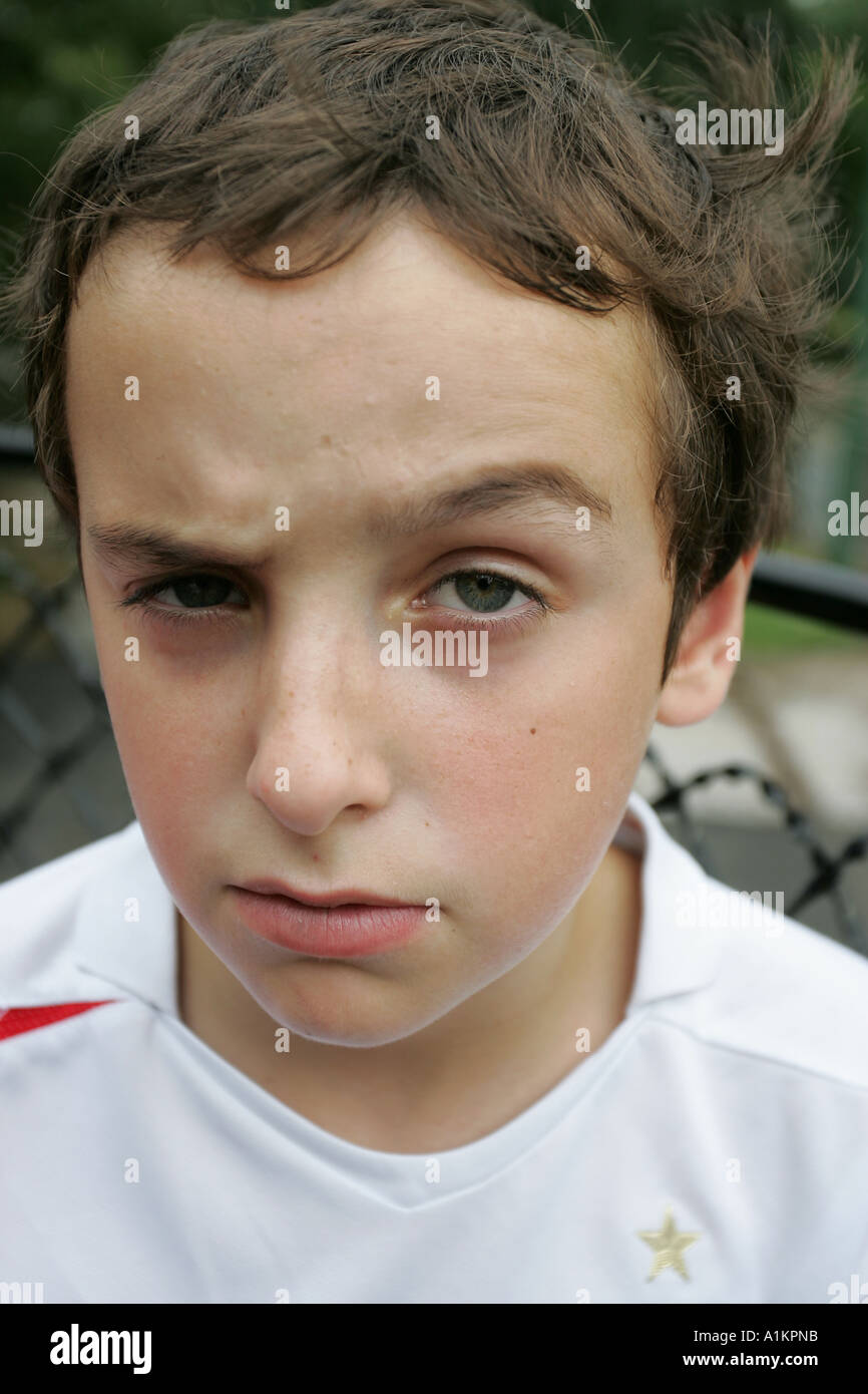 BOY LOOKING SERIOUS Stock Photo - Alamy