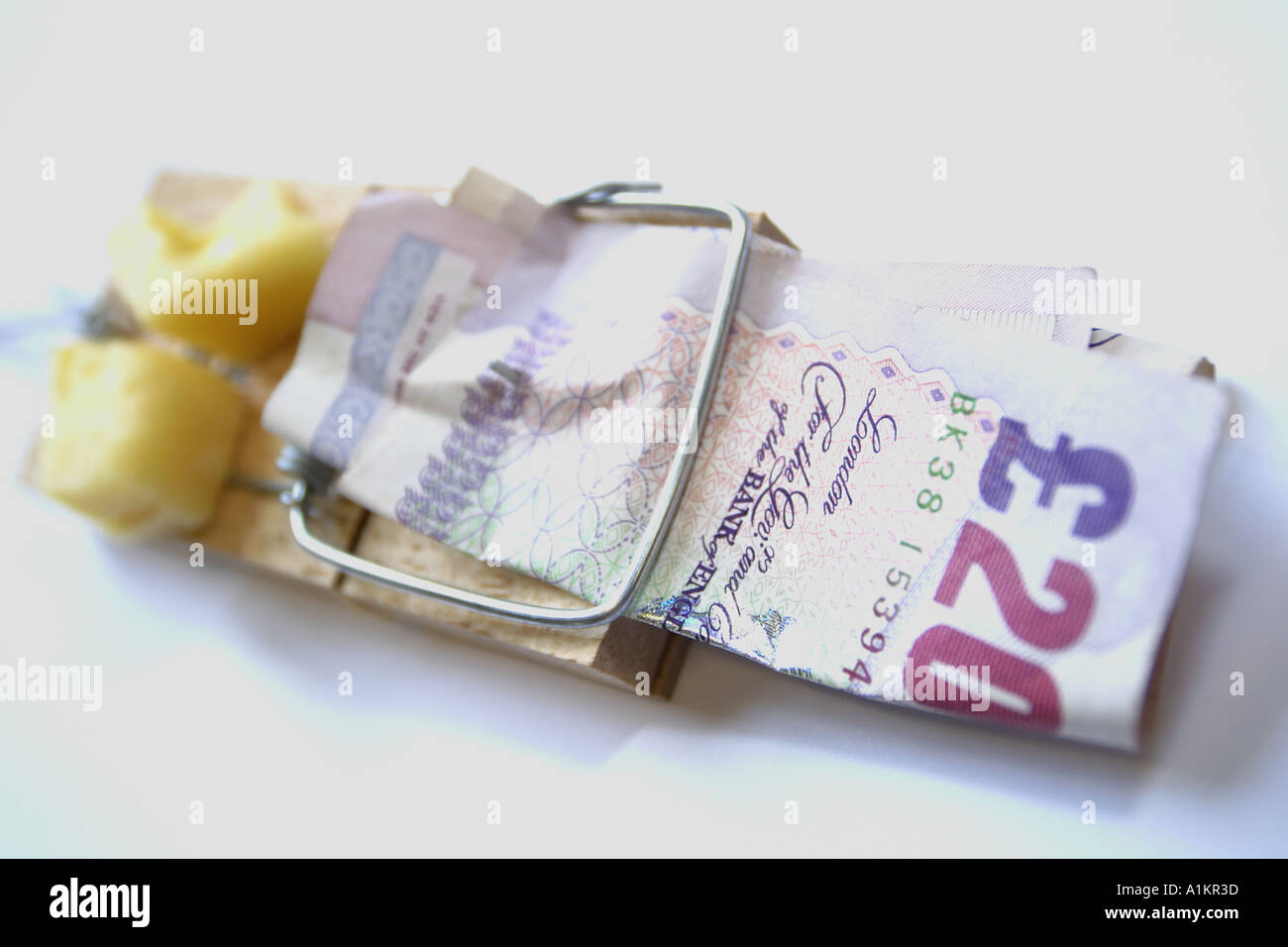 Cash money banknote caught in a mousetrap with cheese bait Stock Photo ...