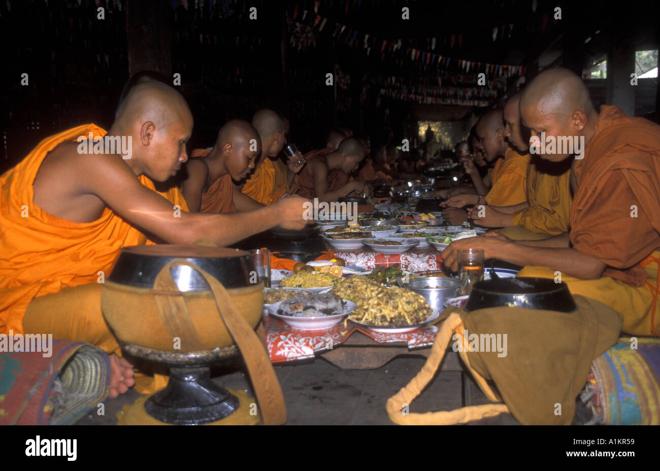BUDDHISM monks share a meal in a monastery in Cambodia Stock Photo - Alamy