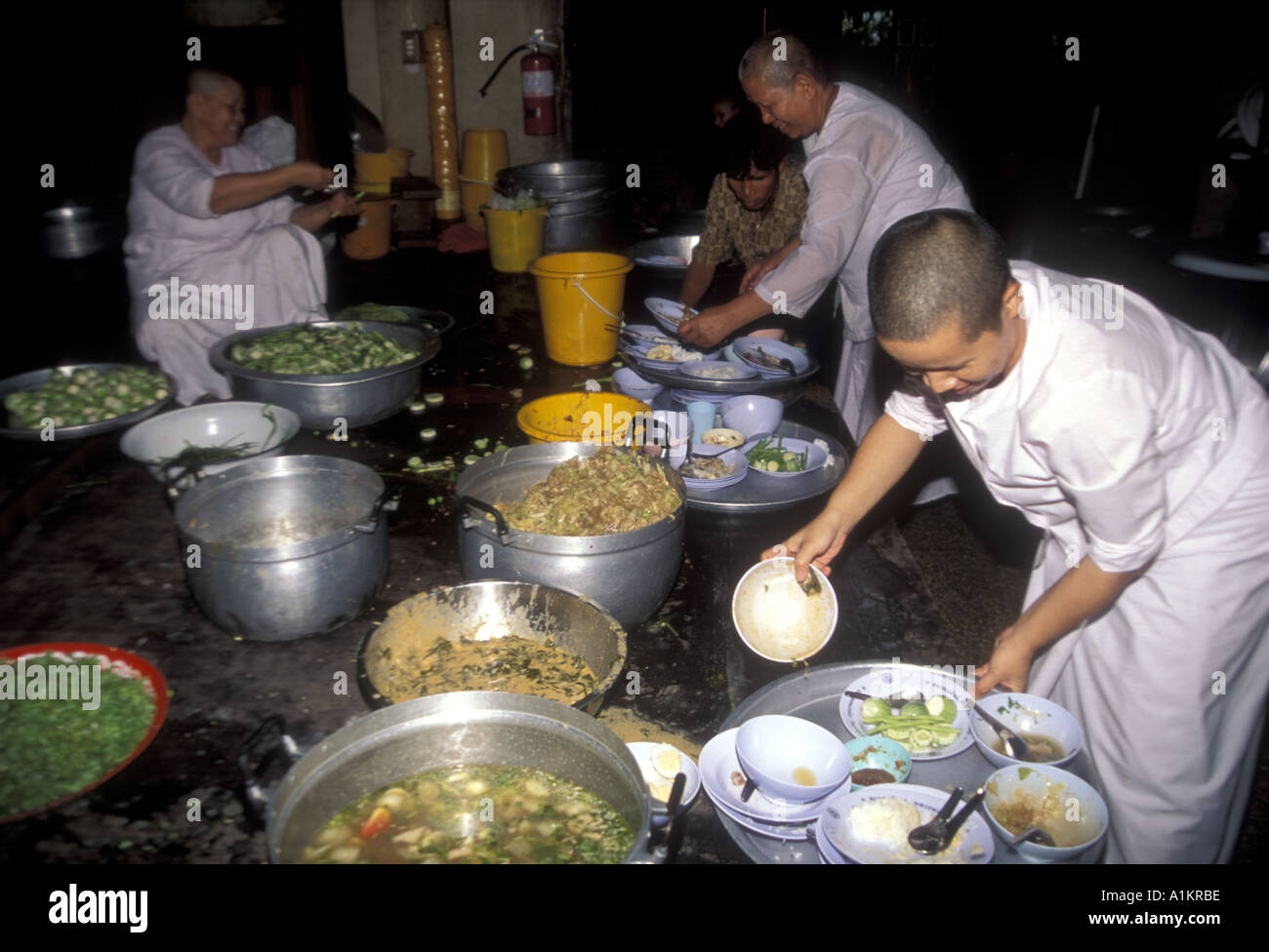 BUDDHISM nuns working in a monastery kitchen Thailand Stock Photo - Alamy