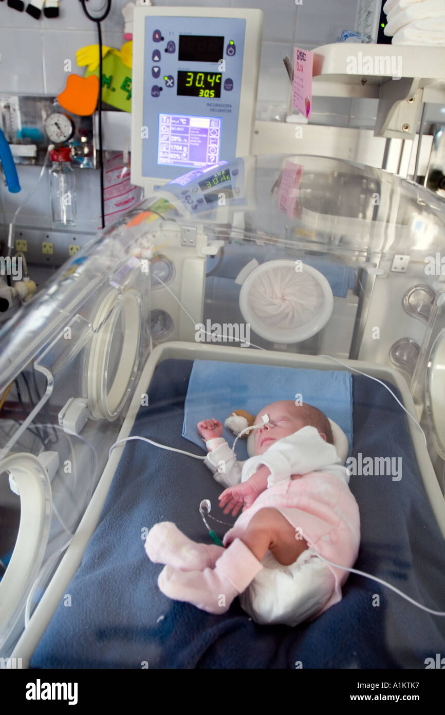 A premature child in a incubator Stock Photo - Alamy