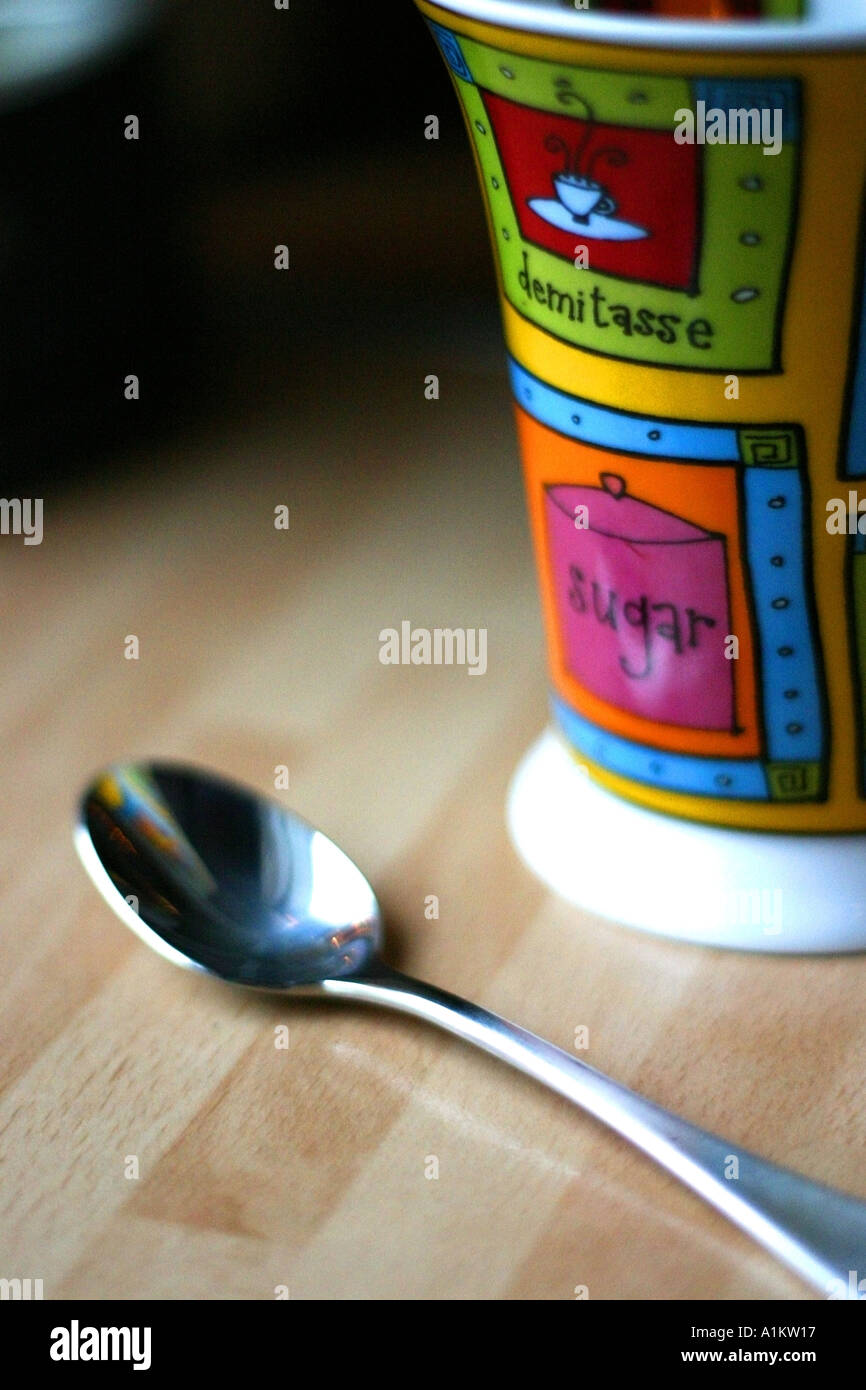 Cup and Spoon laying on a kitchen worksurface cup spoon kitchen coffee ...
