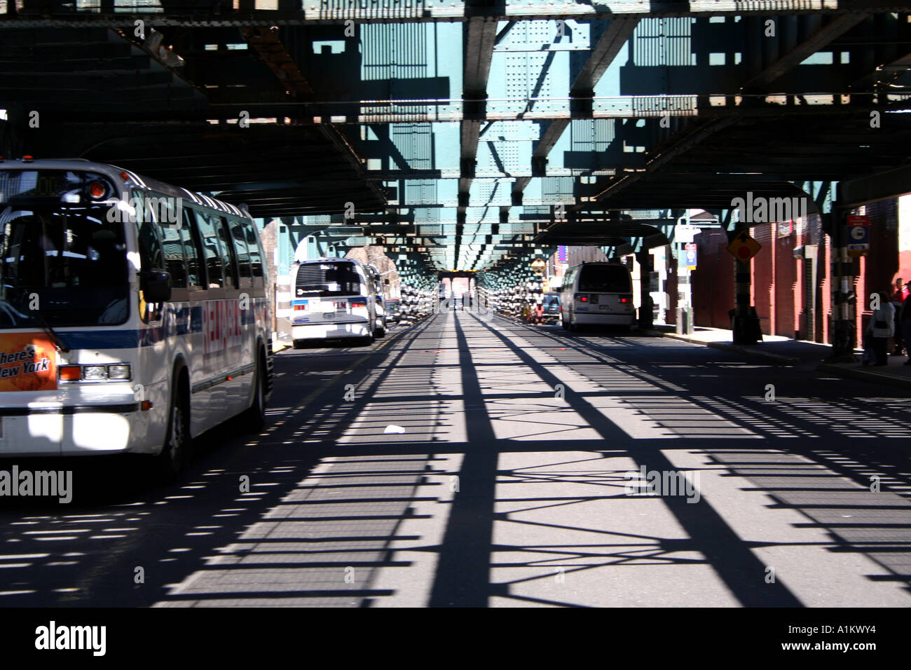 busses under an elevated subway line in NYC Stock Photo - Alamy