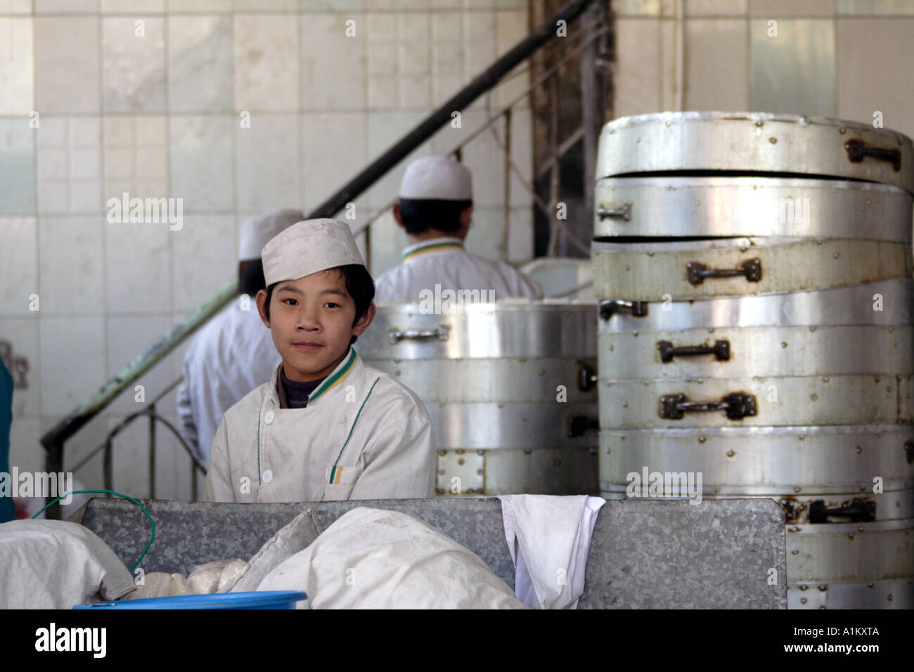 Boy working in a bakery in Beijing, China Stock Photo - Alamy