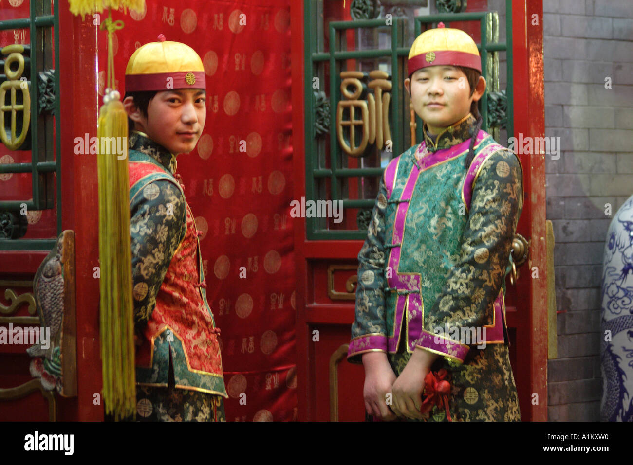 Boy and girl greeters outside a traditional (tourist) restaurant in ...