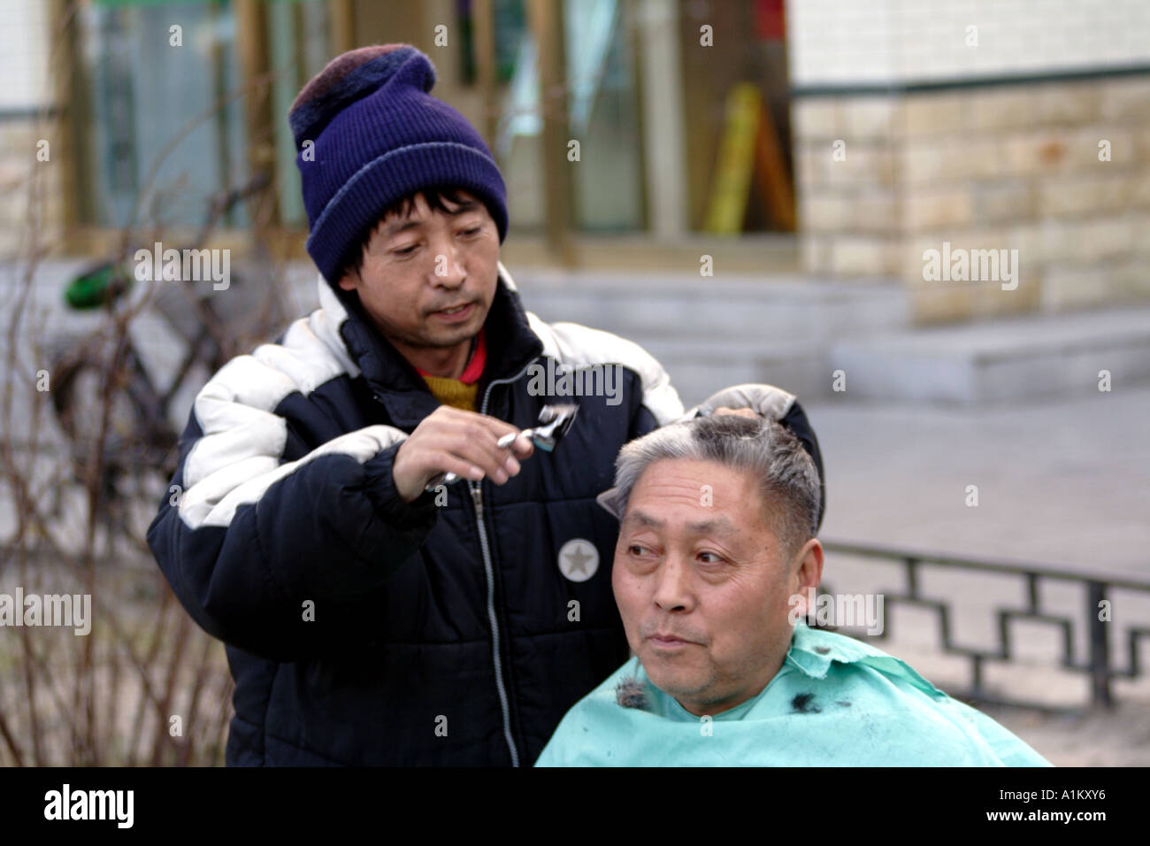 Afternoon haircut in Beijing Stock Photo - Alamy