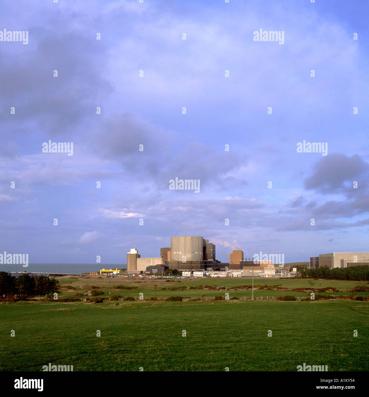 Wylfa Nuclear Power Station in the rural country landscape with blue ...