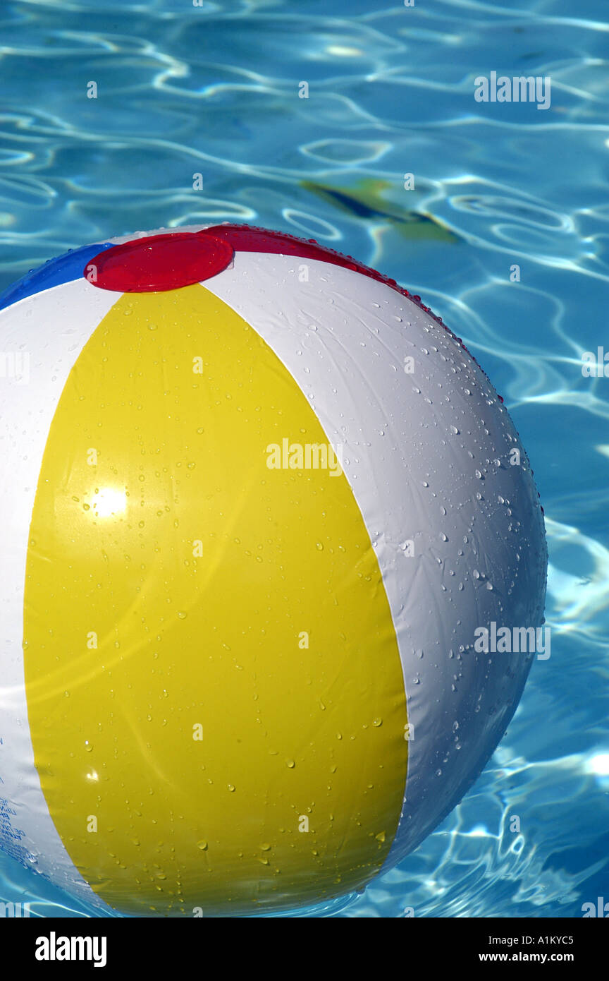 Colorful inflatable ball floats in swimming pool Stock Photo - Alamy