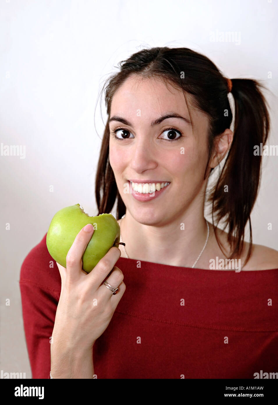 Eating an apple Stock Photo - Alamy