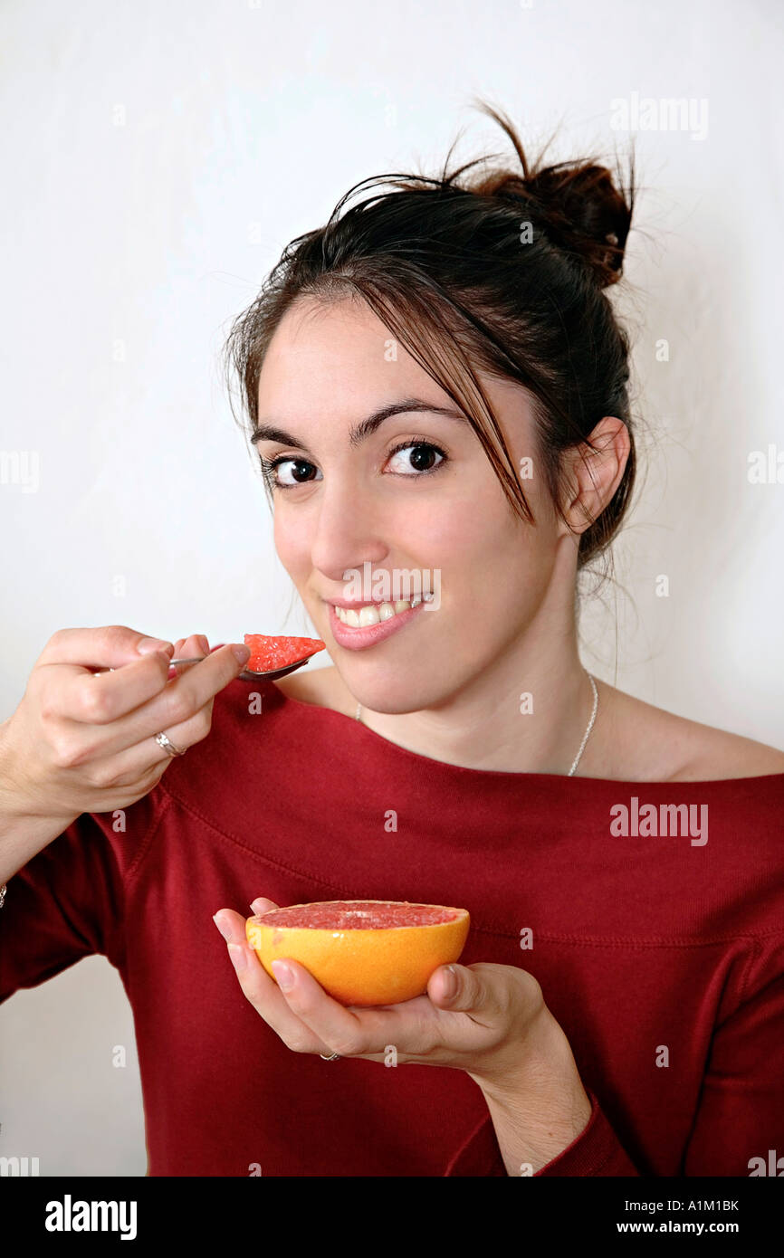 Eating a grapefruit Stock Photo - Alamy