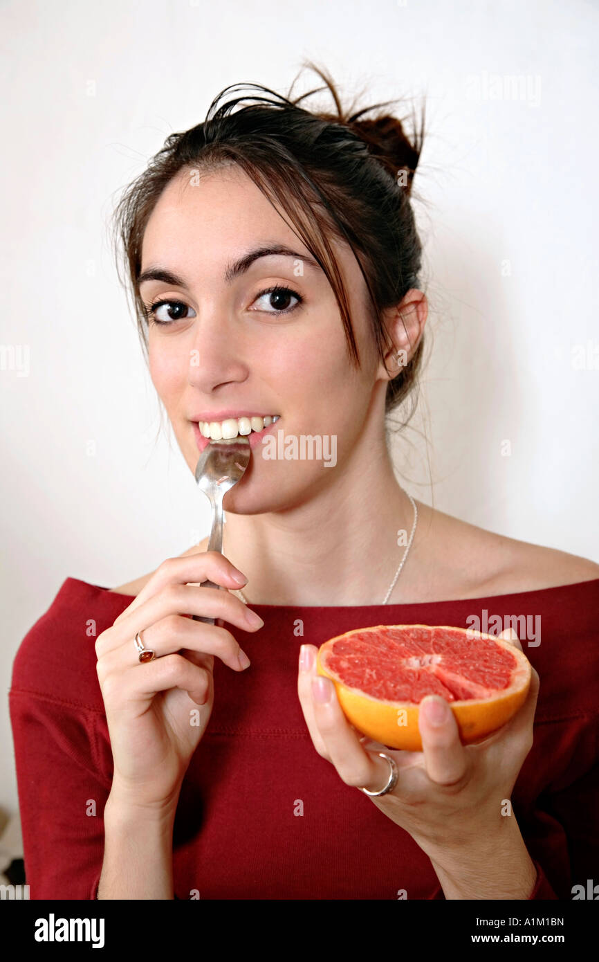 Eating a grapefruit Stock Photo - Alamy