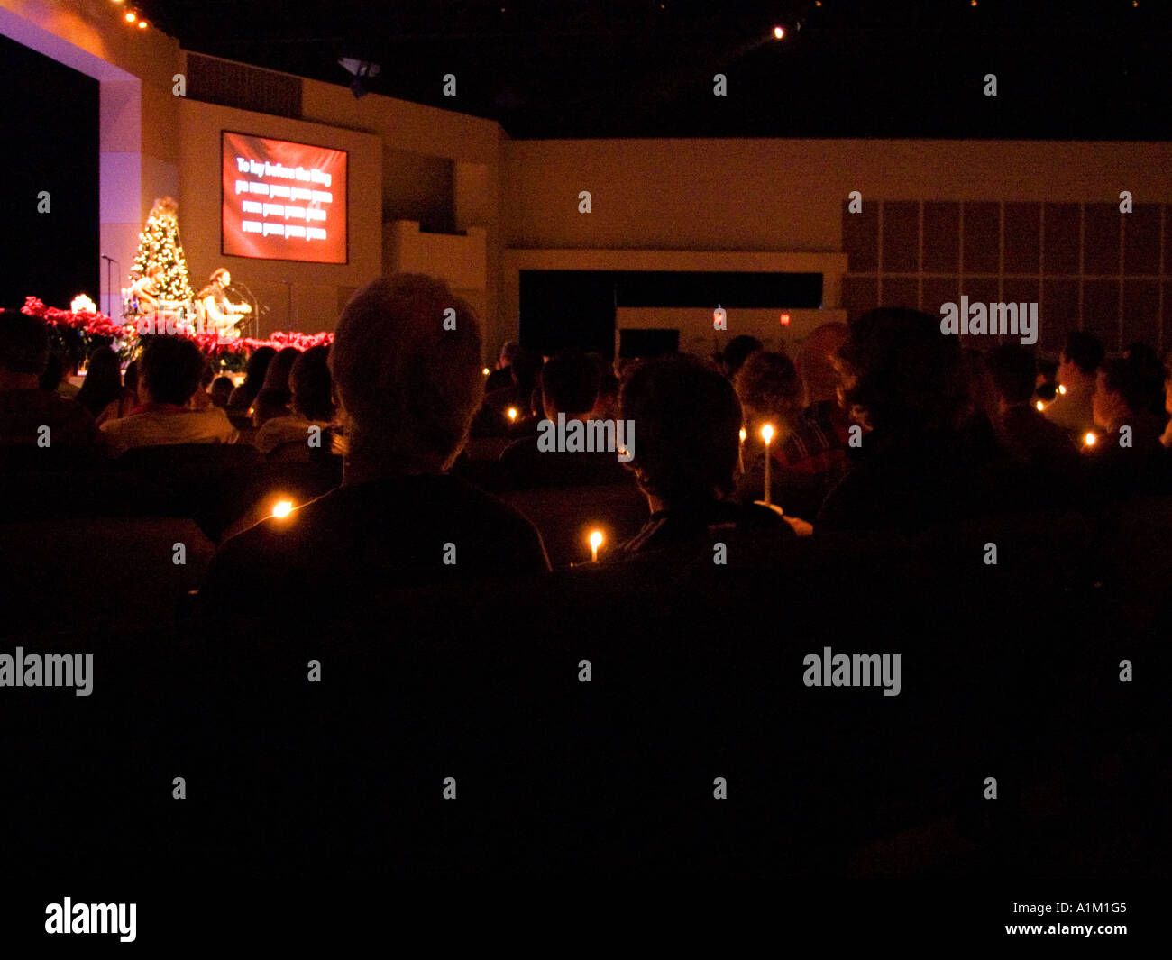 Candle light christmas eve service hi-res stock photography and images ...