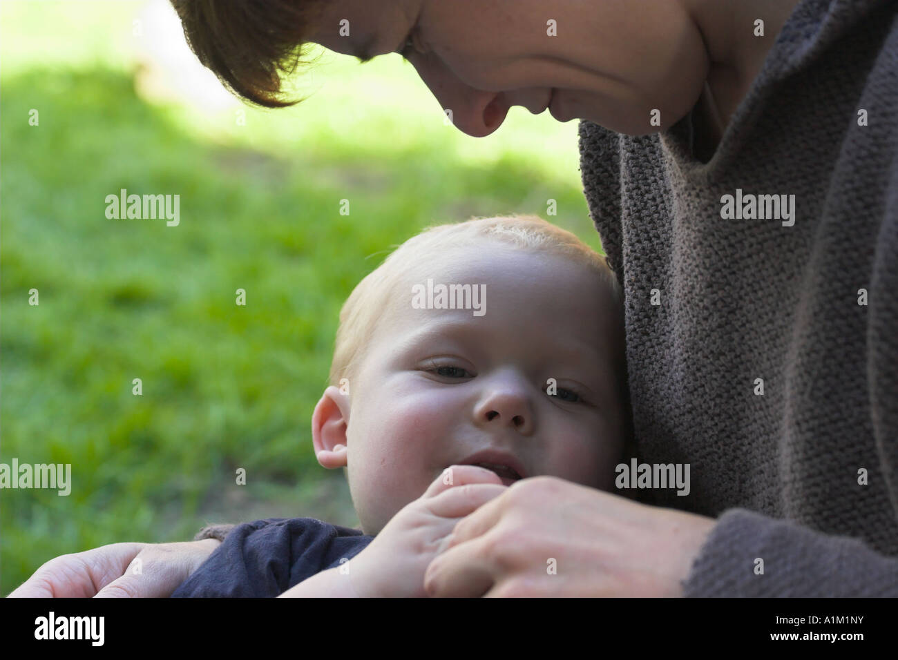 Motherly cuddle hi-res stock photography and images - Alamy