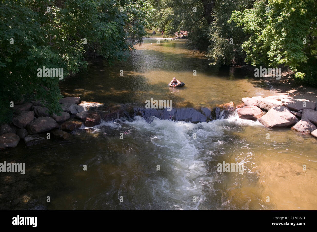 Man floating in an inner tube hi-res stock photography and images - Alamy