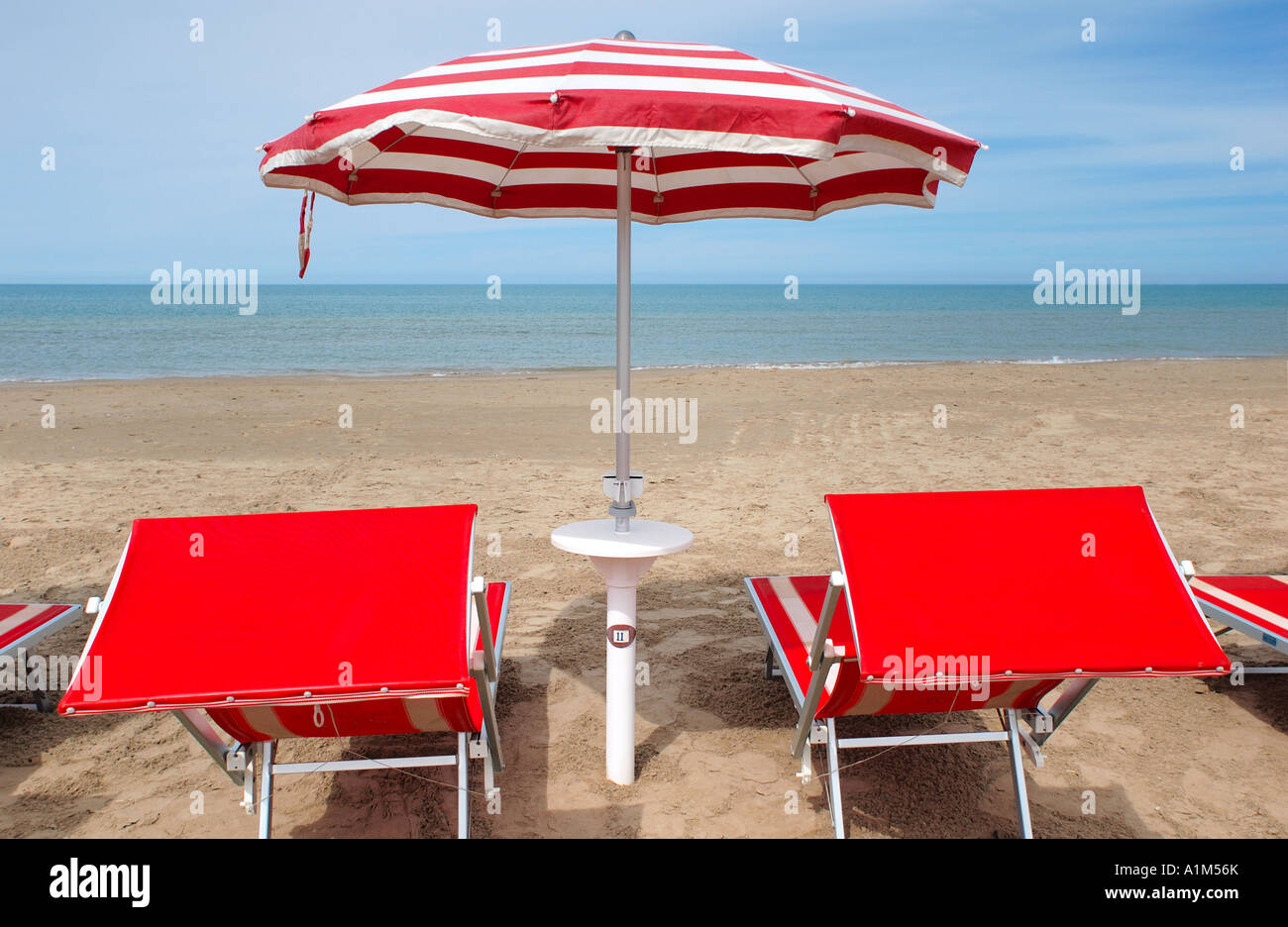 Umbrella and two chairs on the beach, Mediterranean Sea - Italy Stock ...