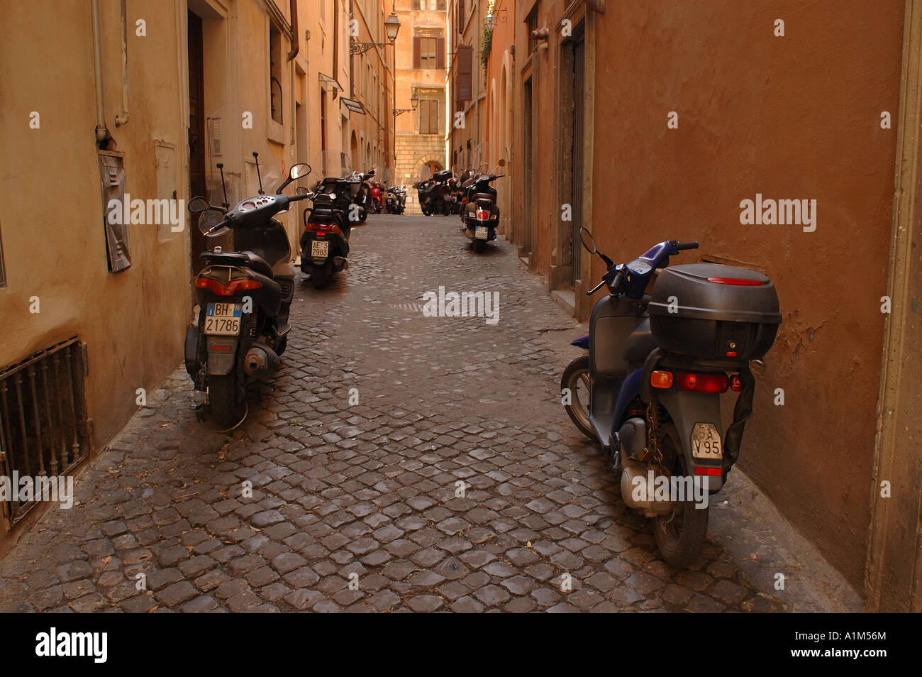 Scooters parked in narrow street in Rome, Italy Stock Photo - Alamy