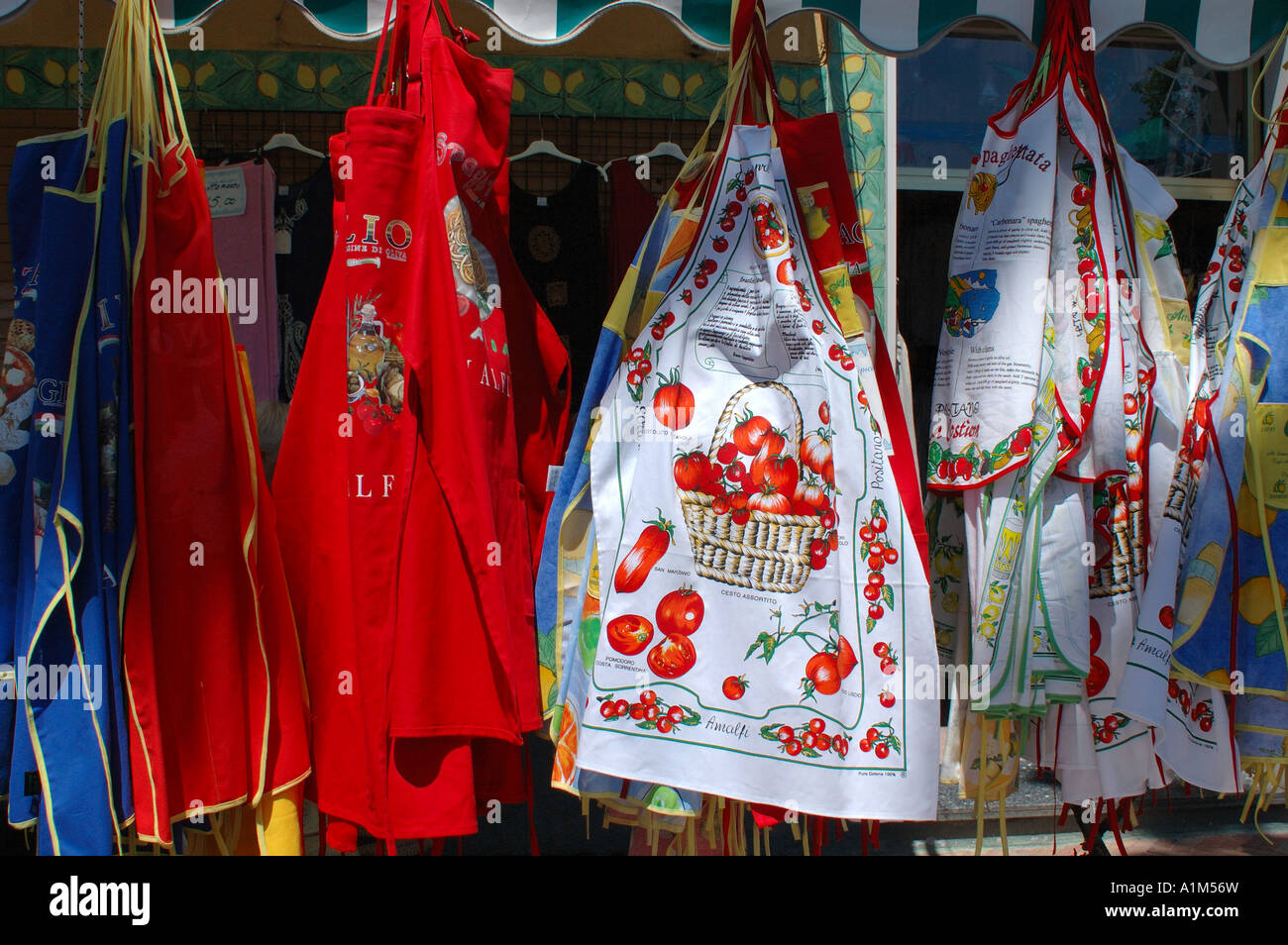 Colorful aprons offered in small shop, Amalfi - Italy Stock Photo - Alamy