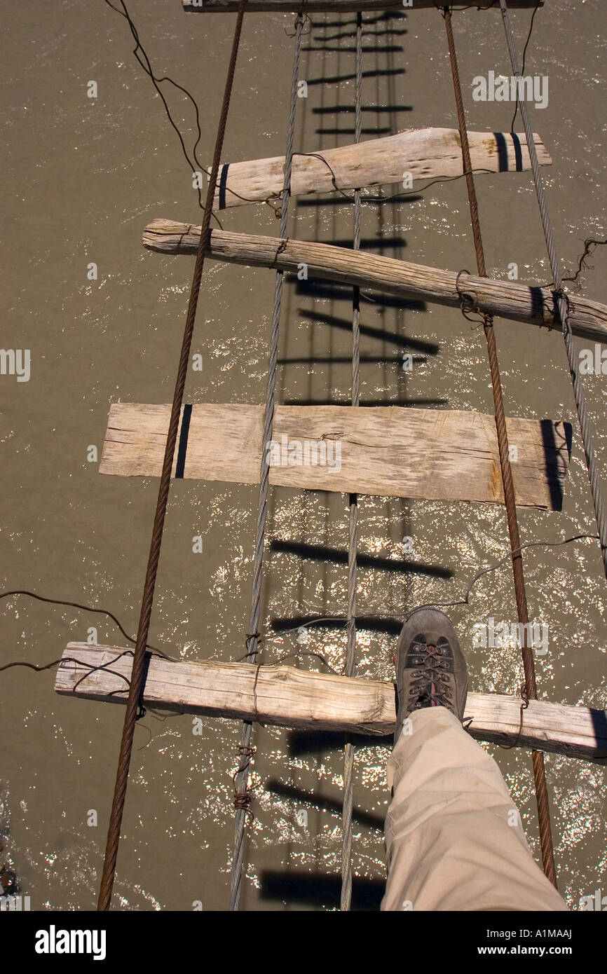 Suspension bridge hanging over Hunza river, Passu, Northern Pakistan ...