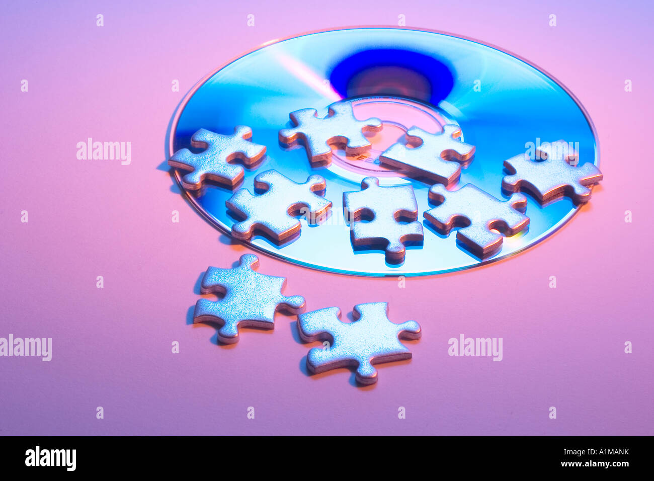 Puzzle Pieces on CD Stock Photo - Alamy