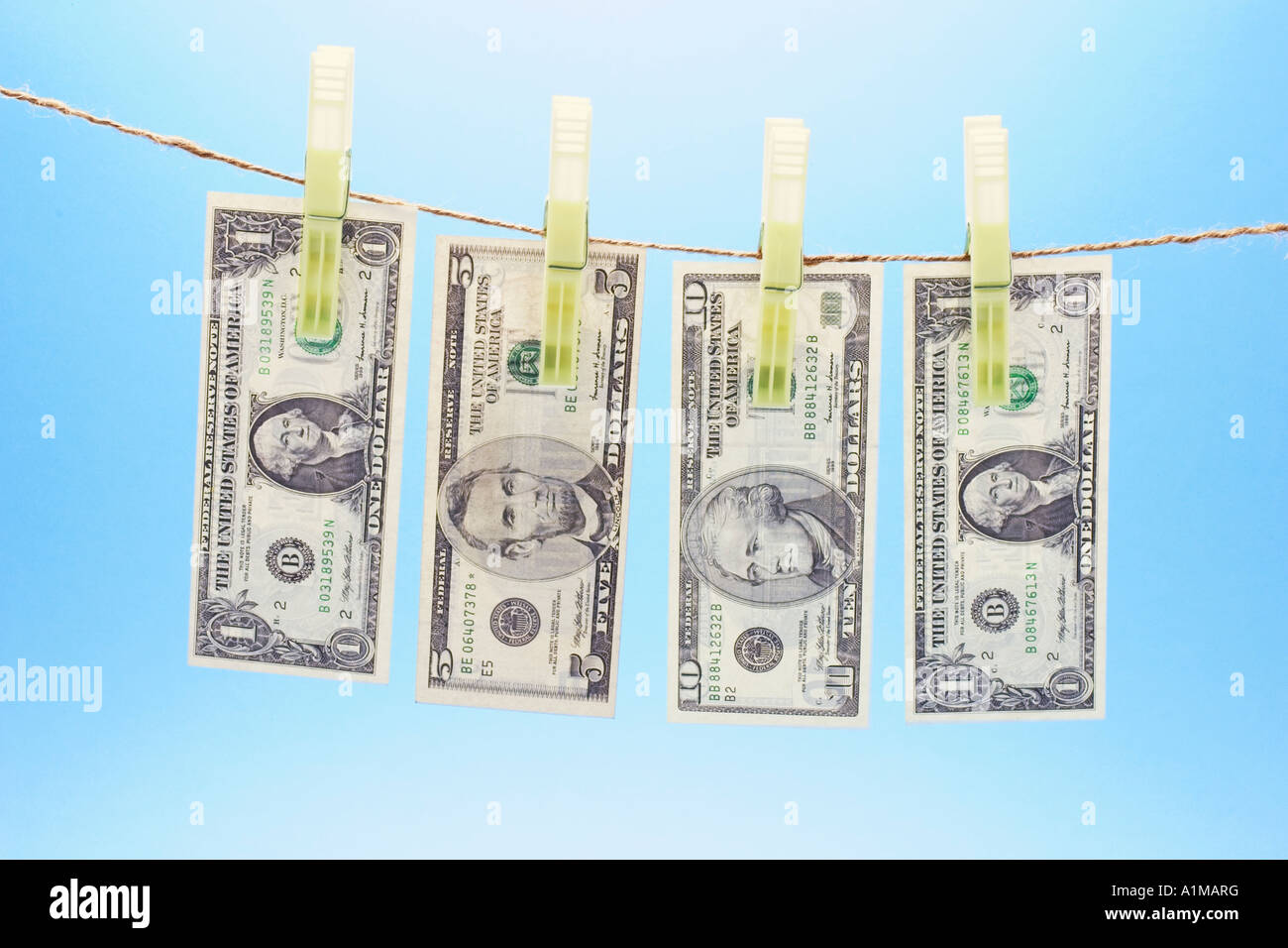 Dollar Notes Hanging on String with Clothes Pegs Stock Photo - Alamy
