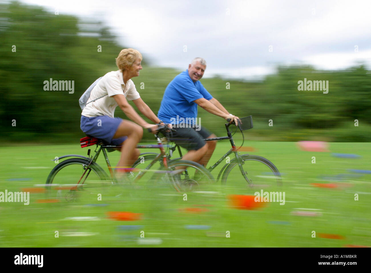 Cyclists using a cycle path in a park setting Stock Photo - Alamy