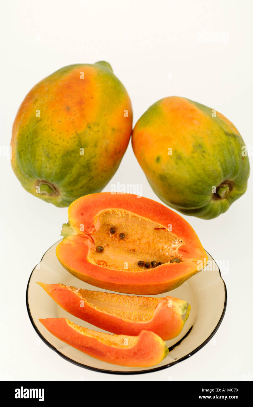 HMA210025 Fruit two full Papaya and three small pieces kept in a plate ...