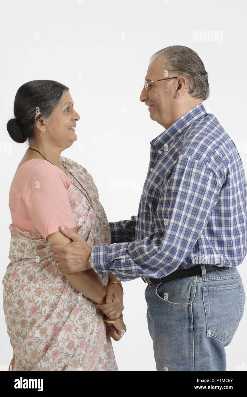Happy Indian senior citizen couple on white background Stock Photo - Alamy