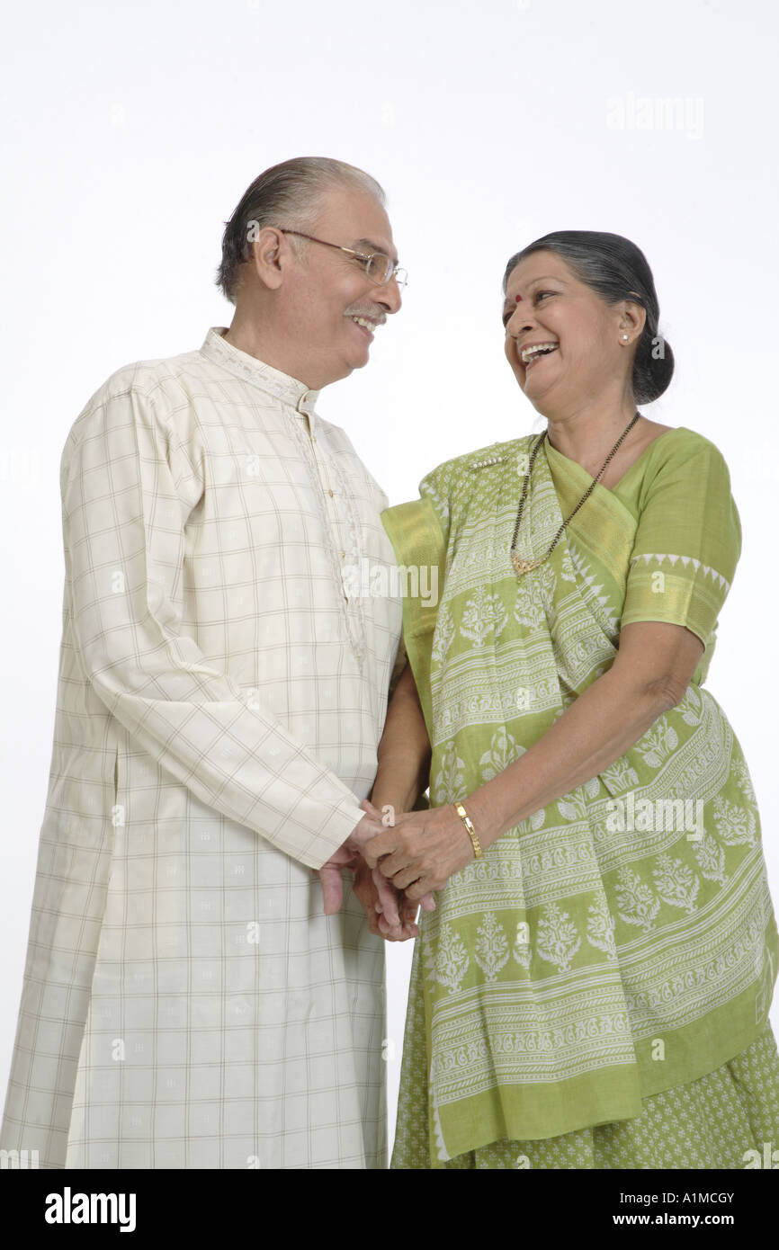 Happy Indian senior citizen couple on white background Stock Photo - Alamy