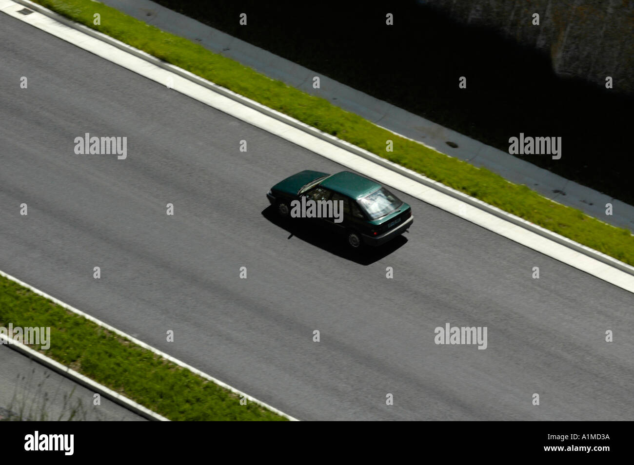 single car on a freshly paved asphalt-road Stock Photo - Alamy