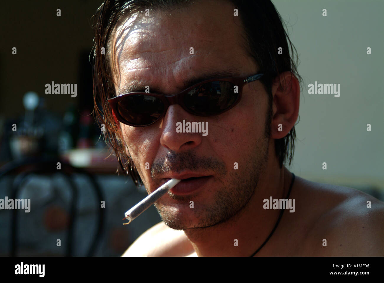 Portrait dark swarthy unshaven smoking shades sunglasses people hi-res ...