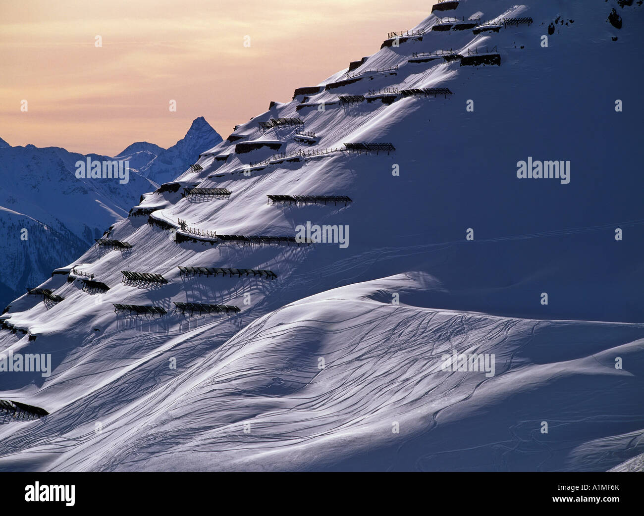 tracks of skiers in snow at evening avalanche barriers skier area of ...