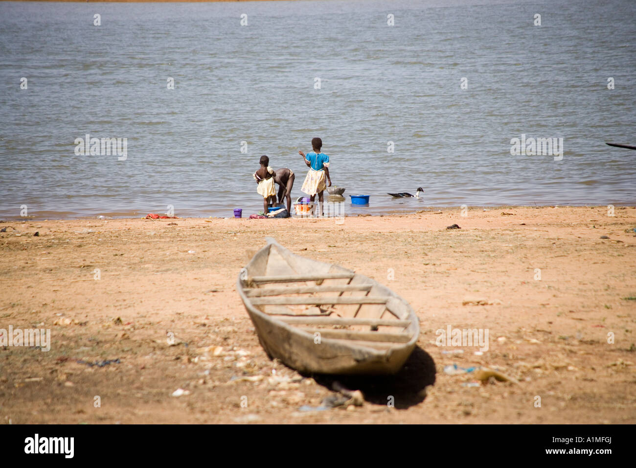 Children washing by theNiger river by the town of Segoukoro the old ...