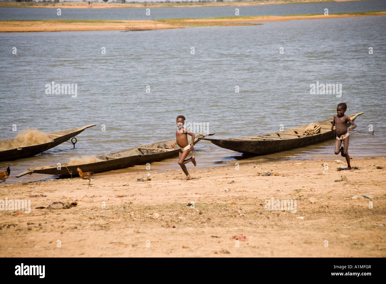Children running by the Niger river by the town of Segoukoro the old ...