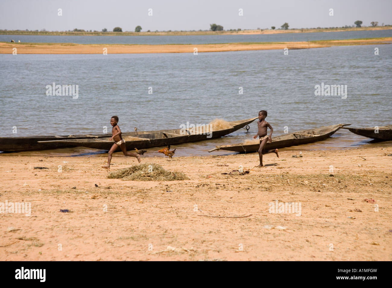 Children running by the Niger river by the town of Segoukoro the old ...