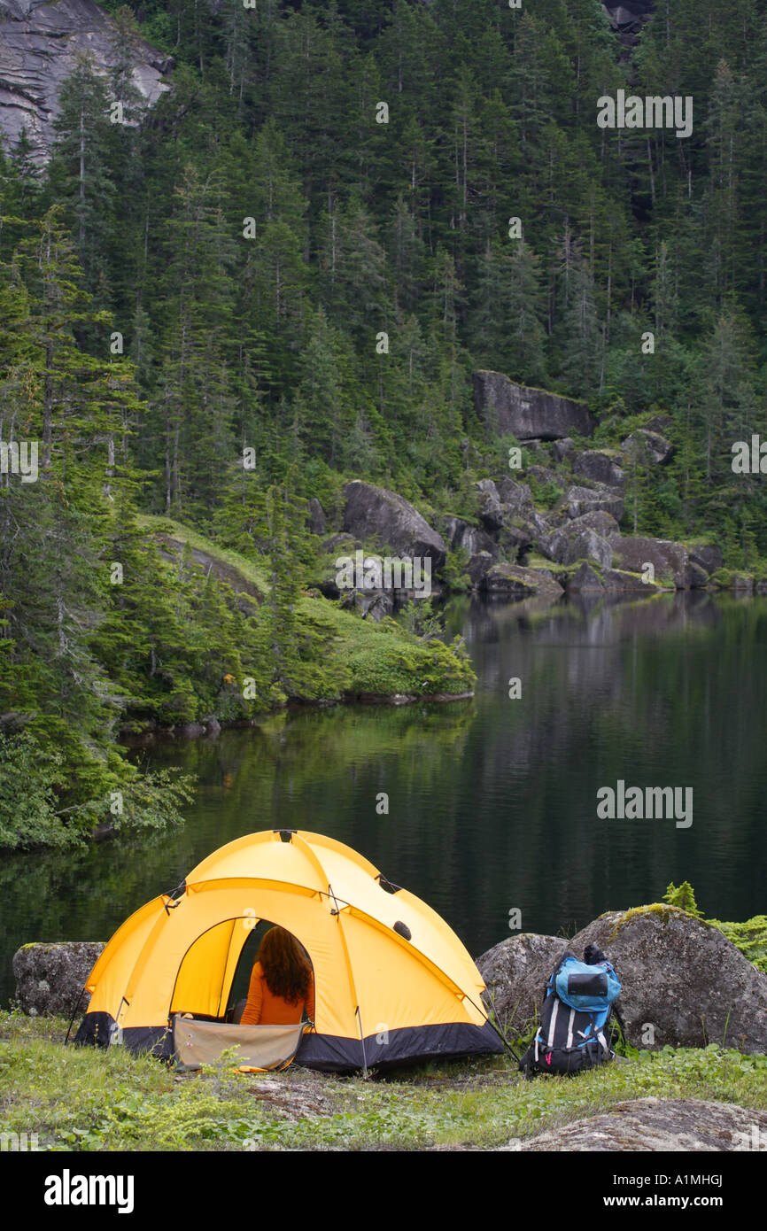 A female backpacker camping on Culross Island Prince William Sound ...