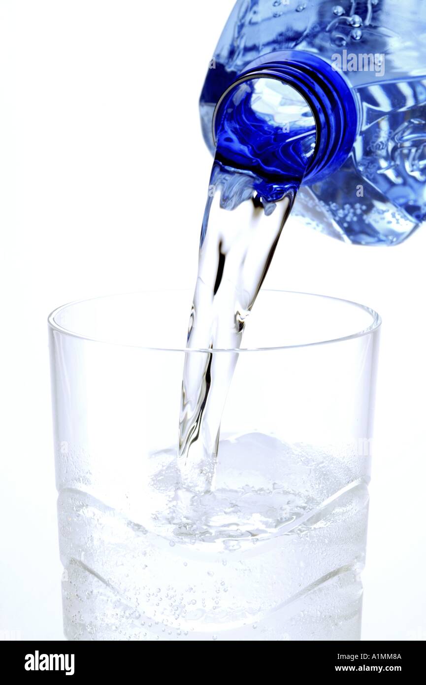 Pouring mineral water into a glass Stock Photo - Alamy