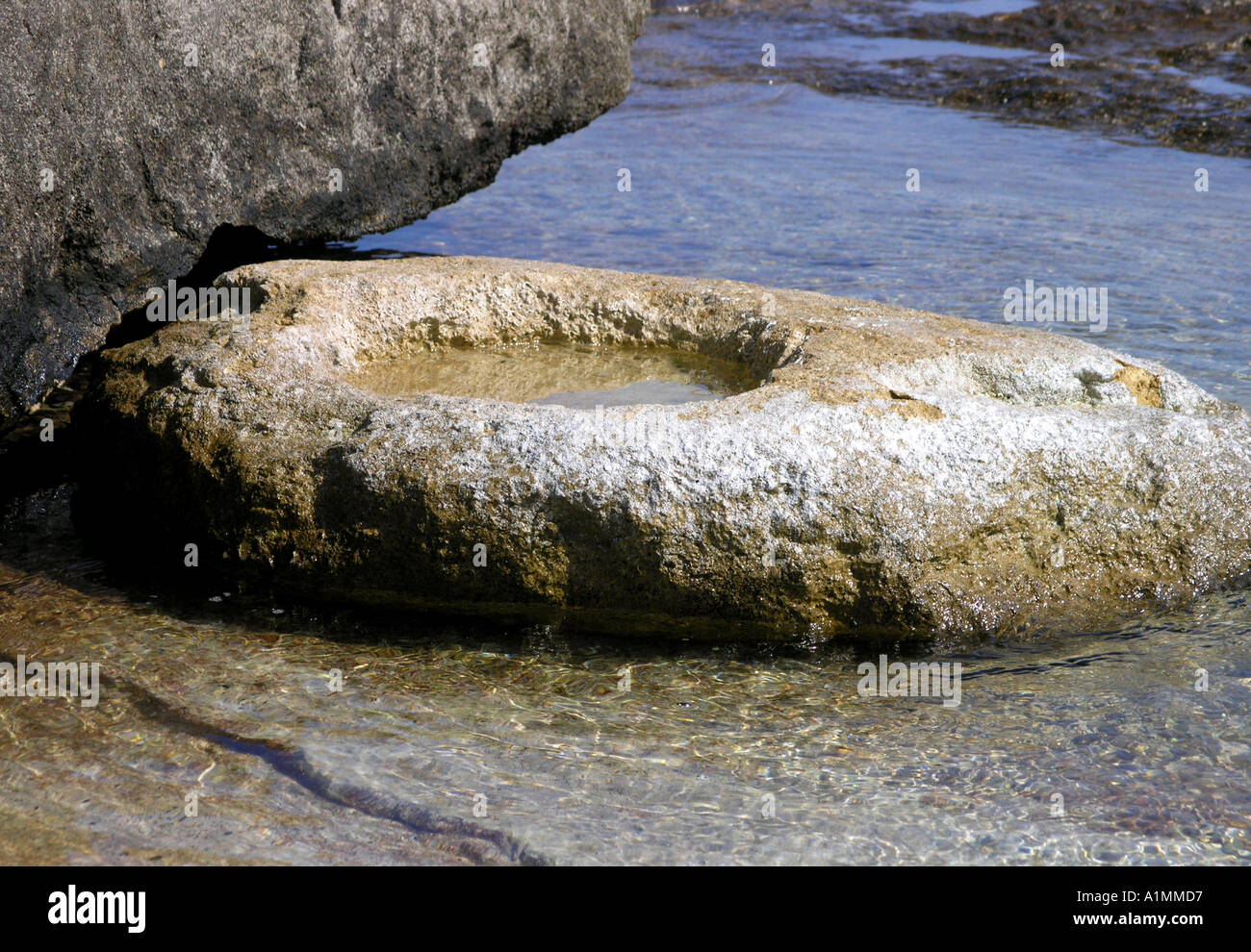 Round Rock filled with sea water Stock Photo - Alamy