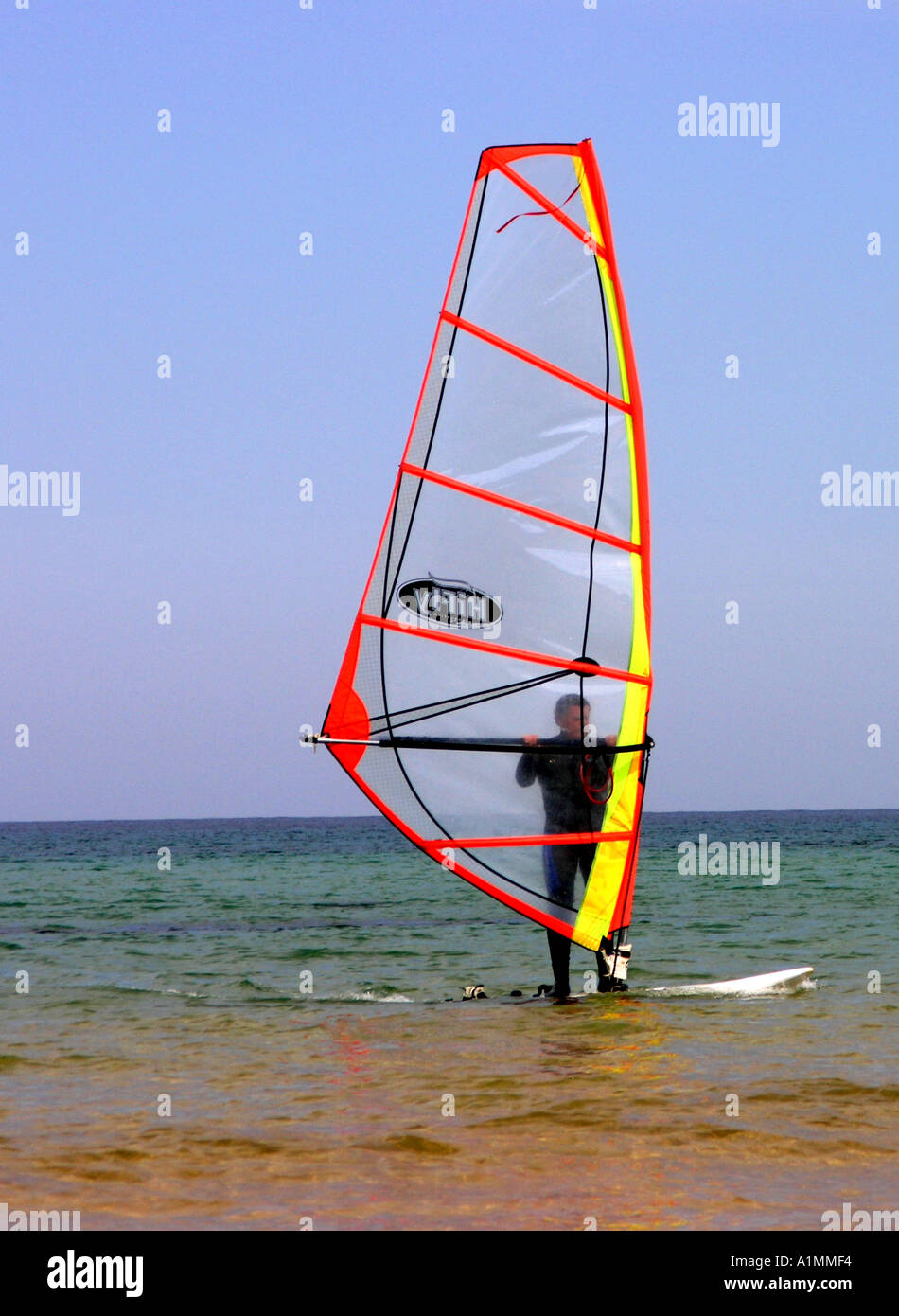 Windsurfer standing up close up Stock Photo - Alamy