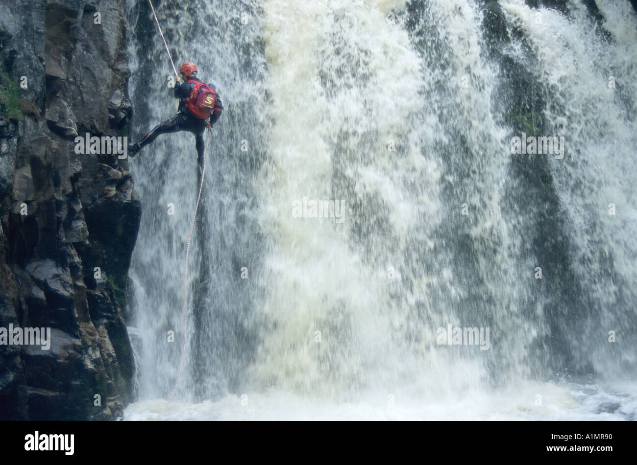 Man water rappelling active hi-res stock photography and images - Alamy
