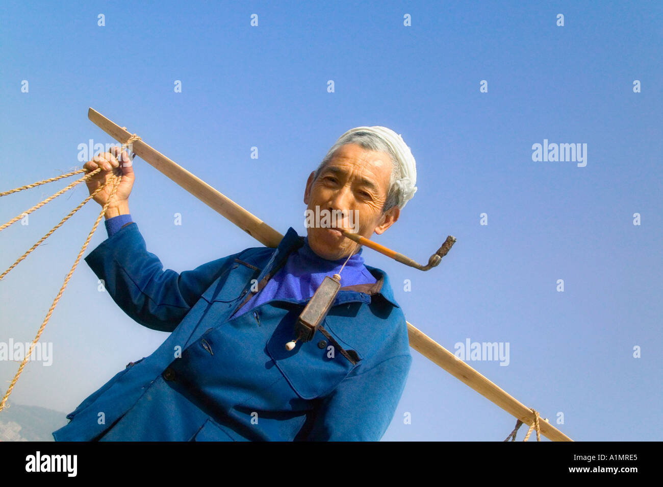 Shoulder carrying pole china hi-res stock photography and images - Alamy