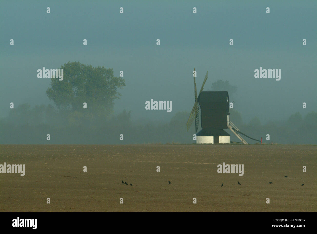 Windmill and mist Stock Photo - Alamy
