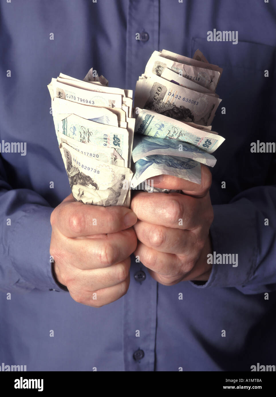 Uk bank notes fist hi-res stock photography and images - Alamy