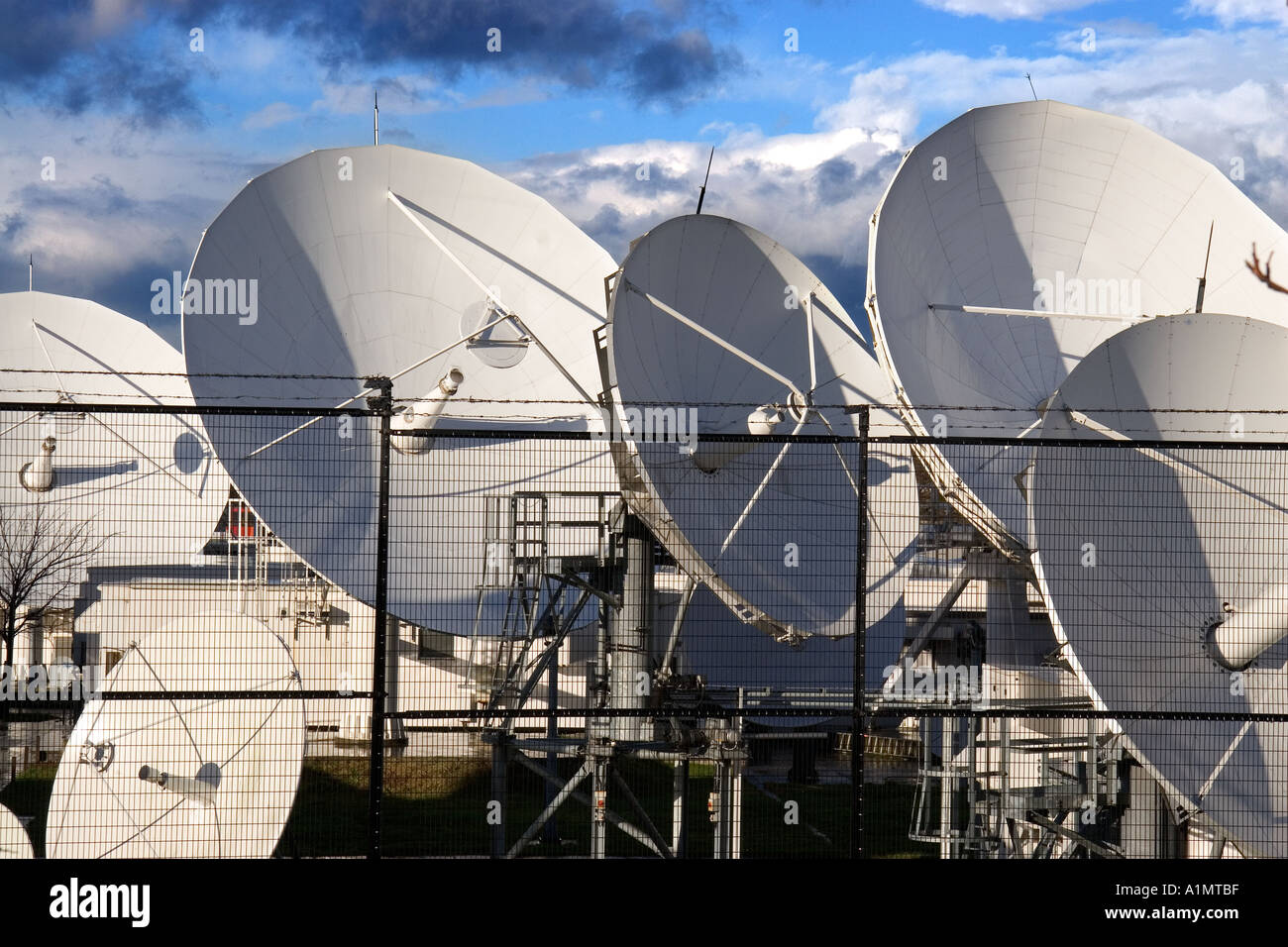 Array of satellite dishes pointing skywards Stock Photo - Alamy