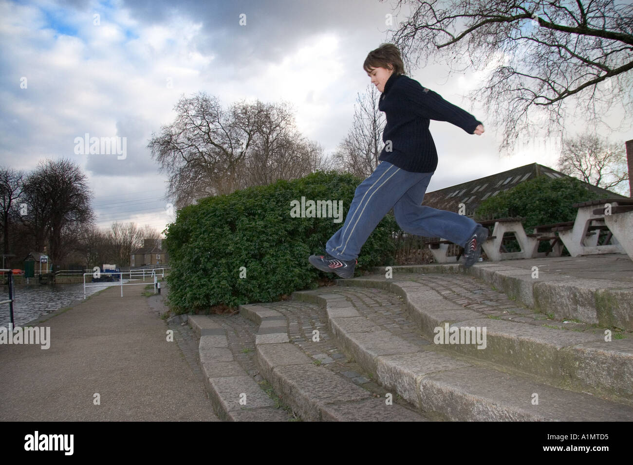Teenage boy jumping over railings hi-res stock photography and images ...
