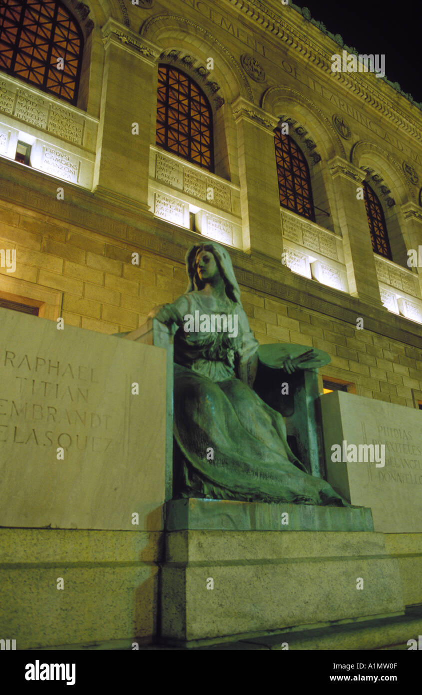 A night shot of one of the Muse statues outside the Boston Public ...
